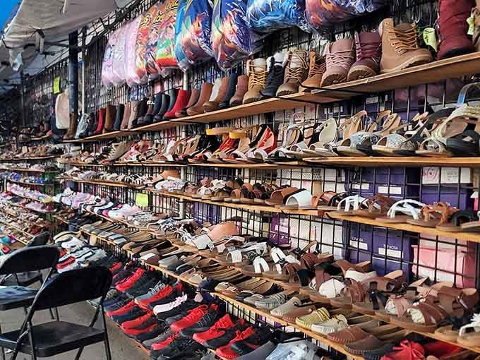 Rows of shoes stretching into infinity, because apparently finding the perfect pair requires approximately seven hundred options.