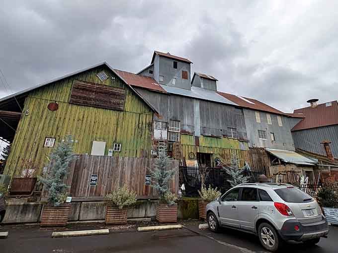 The weathered exterior of Aurora Mills promises adventure, with its patchwork of corrugated metal telling decades of Oregon stories.