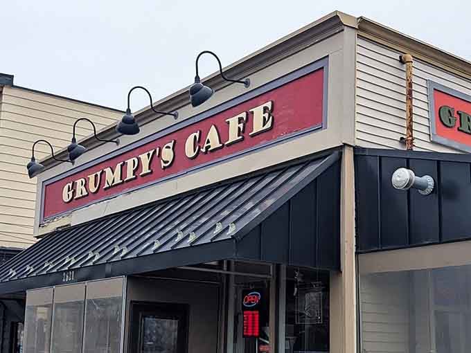 The striped awning and gooseneck lights give off serious vintage diner vibes that never go out of style.