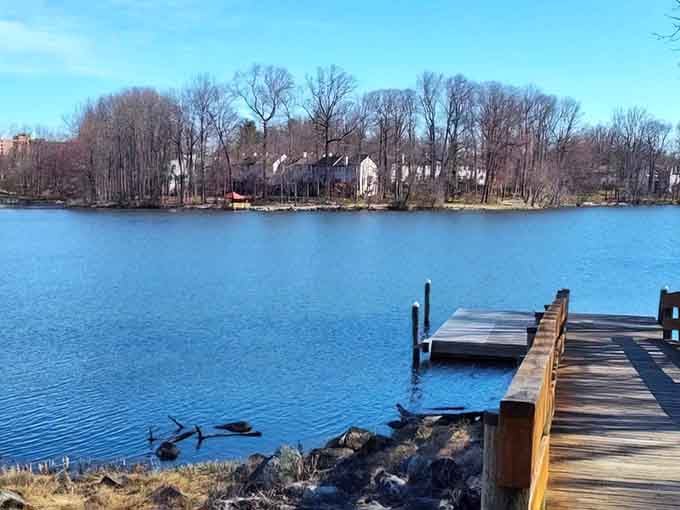 That fishing pier stretches into blue waters like an invitation to pause, breathe, and forget your to-do list.