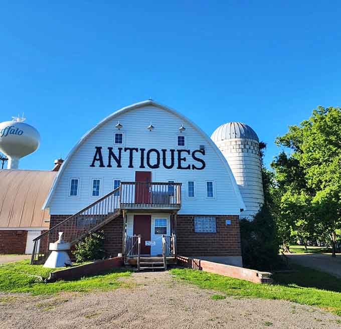 That classic barn blue exterior promises countless discoveries waiting inside for patient treasure hunters.
