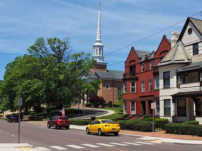 That yellow car and church steeple combo perfectly captures small-town America, where history and everyday life share the same charming street.