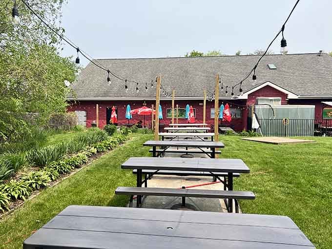 Outdoor seating where summer evenings meet smoky perfection, string lights included for ambiance and romance.