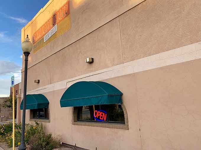 The green awnings and glowing OPEN sign are basically a beacon for anyone craving authentic Mexican food.