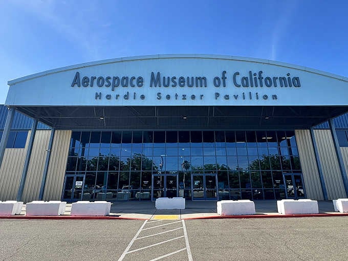 The pavilion's sweeping architecture mirrors an aircraft hangar, fitting for a place where aviation dreams take center stage.