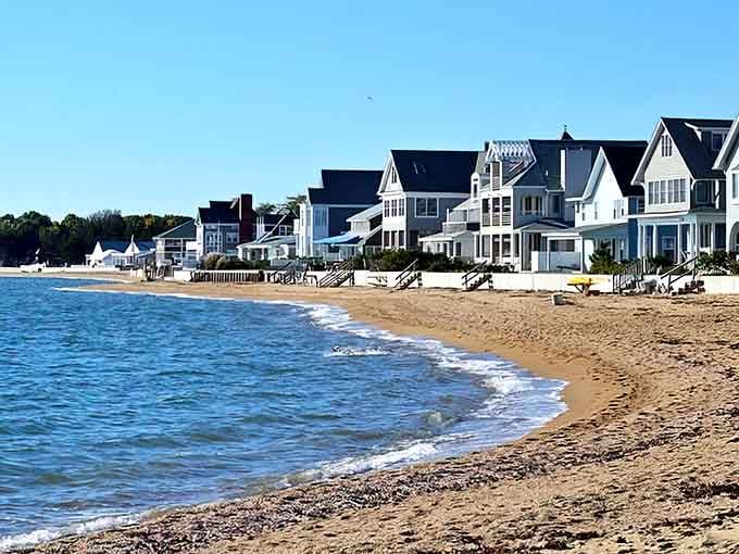 This is what coastal dreams look like: gentle waves, golden sand, and houses that belong on postcards.