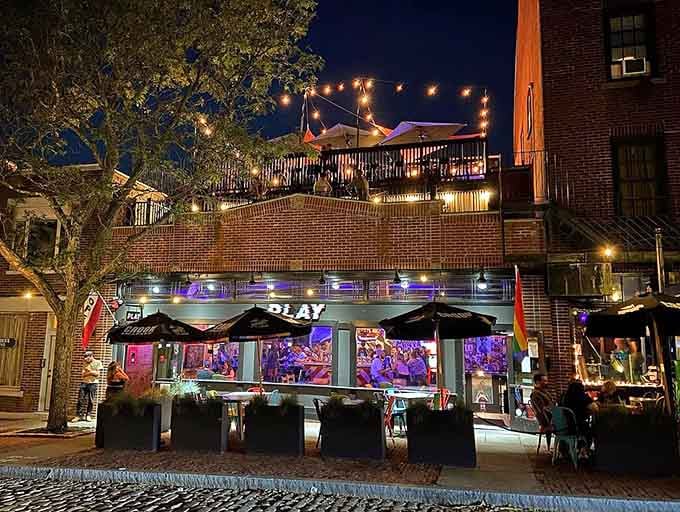 That glowing storefront isn't just inviting, it's practically begging you to come relive your youth with a cold one.