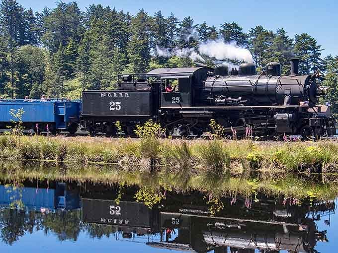 That gleaming steam locomotive reflected in still water creates a mirror image worthy of a double-take.