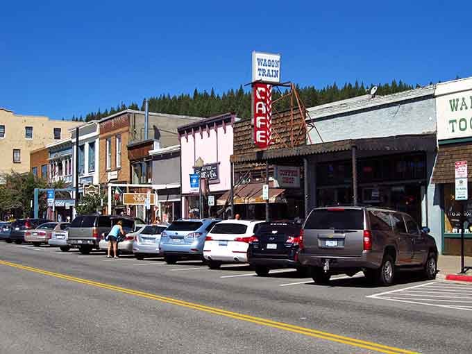 The Wagon Train Cafe sign beckons like a beacon to hungry travelers who've earned their breakfast the hard way.