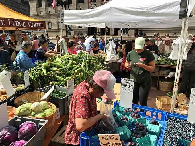 White tents bloom across Copley Square like a produce-filled garden that actually requires zero weeding from you.