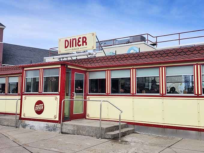 That red and cream exterior isn't just architecture – it's a time machine disguised as breakfast headquarters.