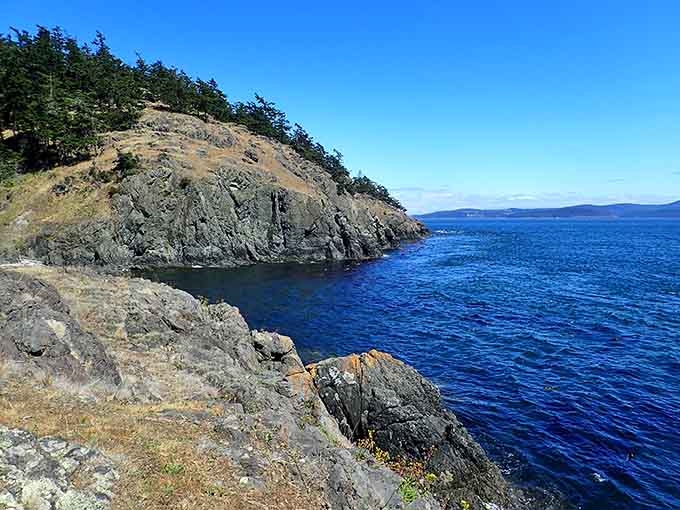Rocky shores meet endless blue horizons where your biggest worry is which view to photograph first.