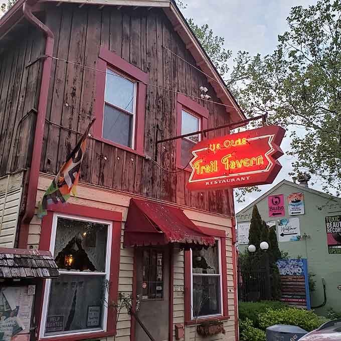 That weathered wood and glowing neon sign aren't trying to look old, they've earned every gorgeous year of patina.