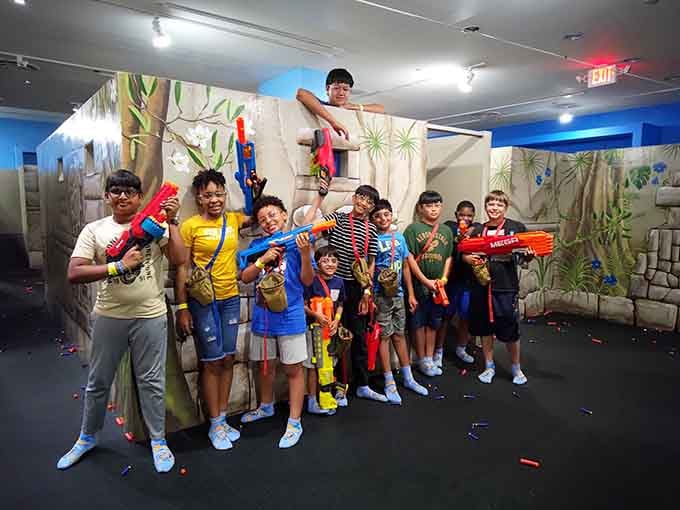 The storefront beckons with promises of foam-fueled mayhem, where shopping mall meets battlefield in the best possible way.