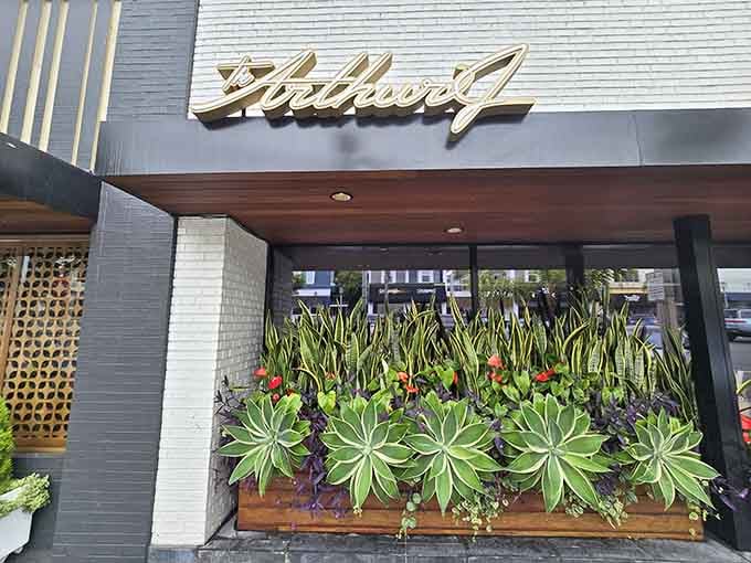 That vintage script signage and mid-century facade practically whisper "come in, we've got serious beef waiting for you."