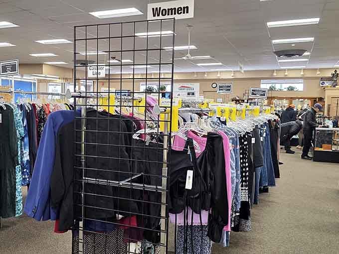 Organized racks make finding your size actually possible, proving that thrift shopping doesn't require an archaeology degree after all.