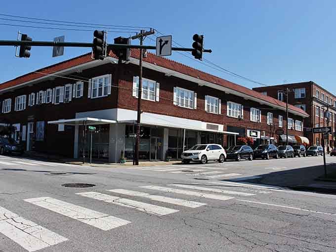 Classic brick buildings anchor the corner with timeless style, proving that good architecture ages better than most of us do.