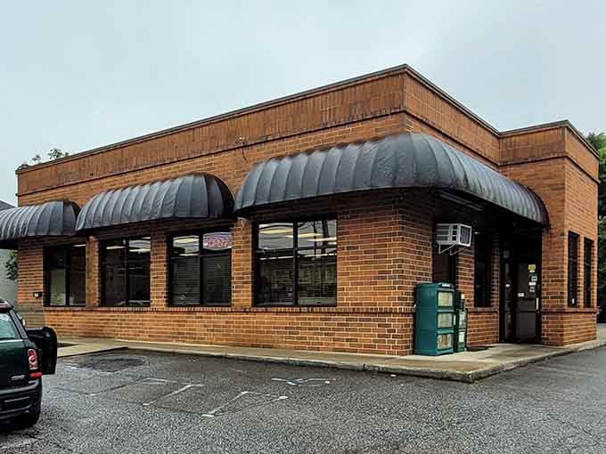 That classic brick exterior with those distinctive awnings is your first clue that something delicious is waiting inside.