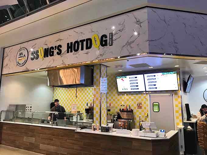 That cheerful yellow checkerboard pattern isn't just decoration—it's practically radiating happiness before you even order your first corn dog.
