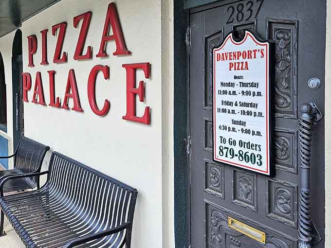 Those benches by the ornate door aren't just decoration; they're where families wait eagerly for their table inside.