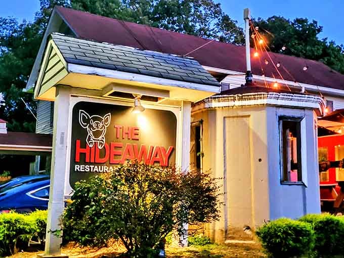 That glowing sign at dusk promises exactly what's inside: seriously good food worth finding.