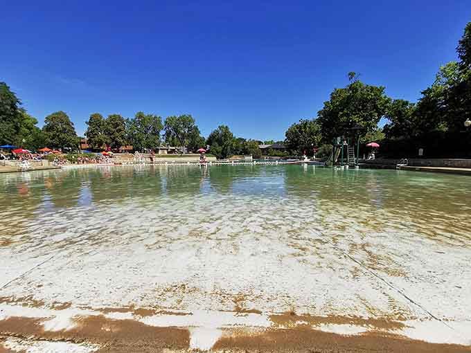 Sandy shores meet pristine quarry water, creating a beach experience that feels delightfully out of place in the Midwest.