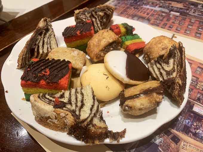 A dessert platter so colorful and varied it looks like someone raided every bakery case in Manhattan simultaneously.