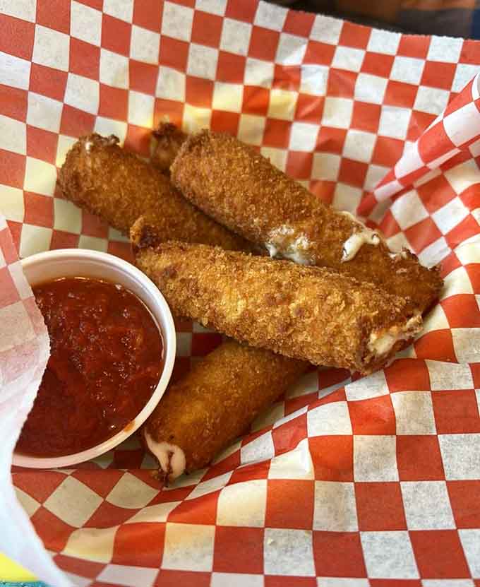 Crispy mozzarella sticks with marinara sauce prove that sometimes the simplest pleasures are the most satisfying ones around.