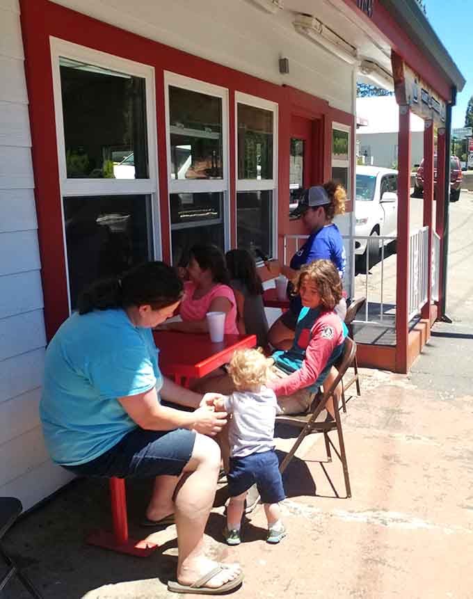 Families gathering at picnic tables for burgers: Norman Rockwell would've painted this scene if he'd known about it.