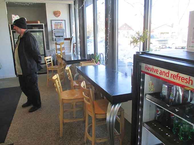 Simple wooden tables and bright windows create a space where lingering over pastries feels like the right life choice.