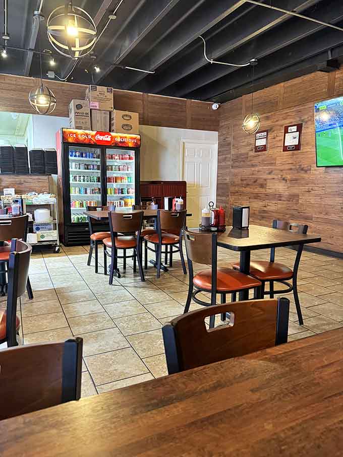 The casual dining area features wood accents and industrial touches that keep the focus squarely on the food.
