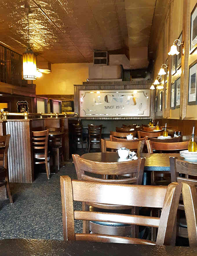 The dining room stretches back with booth seating and tables, offering space for everyone from solo diners to family celebrations.