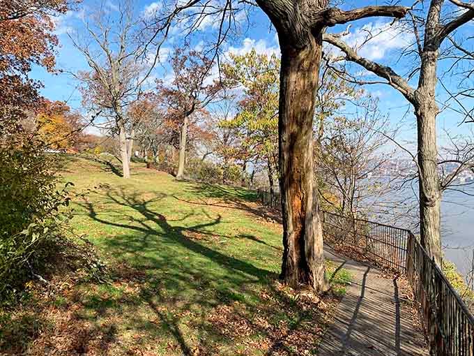 Rolling green lawns meet dramatic cliff edges, creating the kind of contrast that makes photographers weep with joy.
