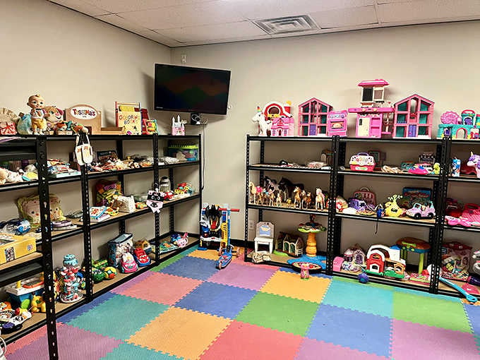 A dedicated toy area with colorful foam flooring where childhood treasures await their next adventure.