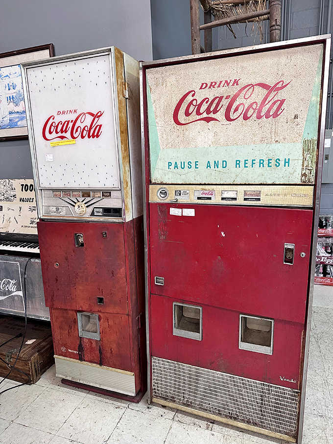 Vintage Coca-Cola vending machines stand like red sentinels guarding memories of ice-cold bottles and simpler times.