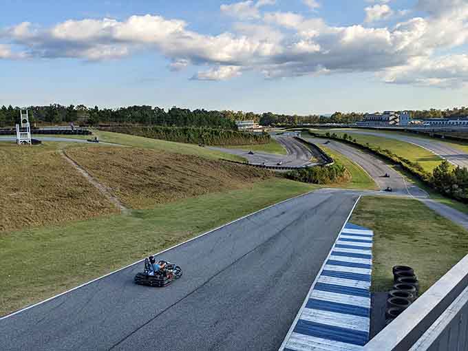 A solitary kart navigates the sweeping circuit, demonstrating the beautiful isolation that comes with chasing the perfect racing line.