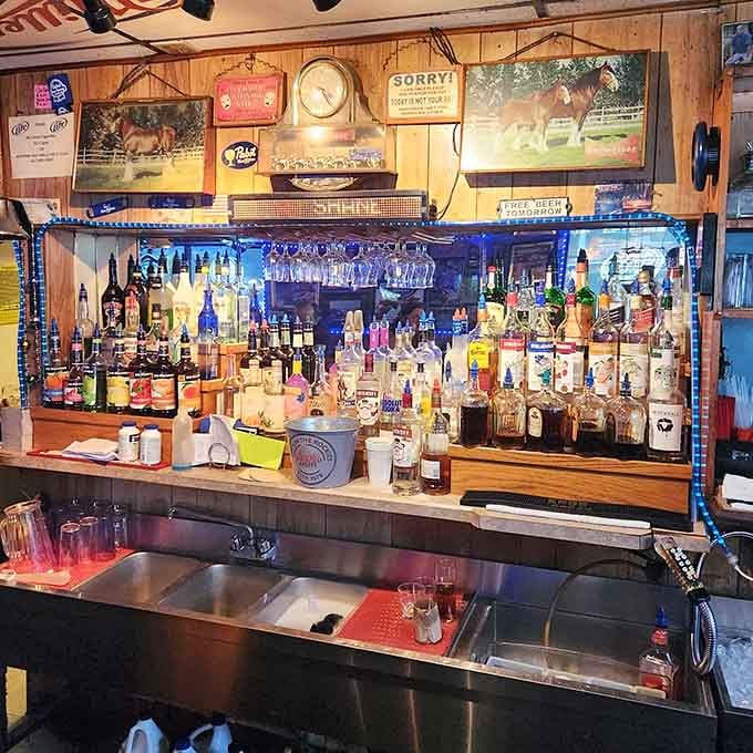 A well-stocked bar lined with blue lights proves this place takes both atmosphere and libations seriously.