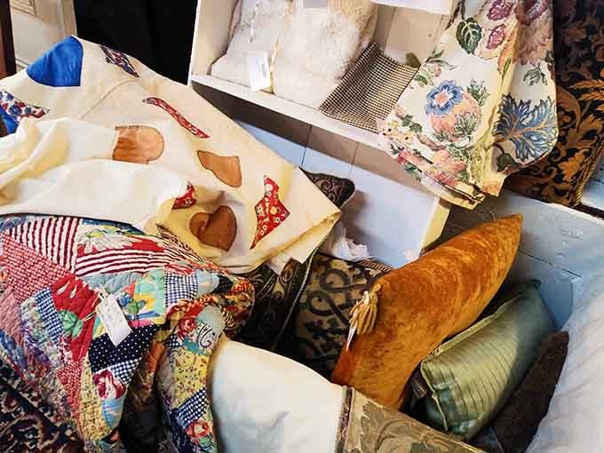 Handmade quilts and decorative pillows offer cozy charm that took someone hours of careful stitching to create perfectly.