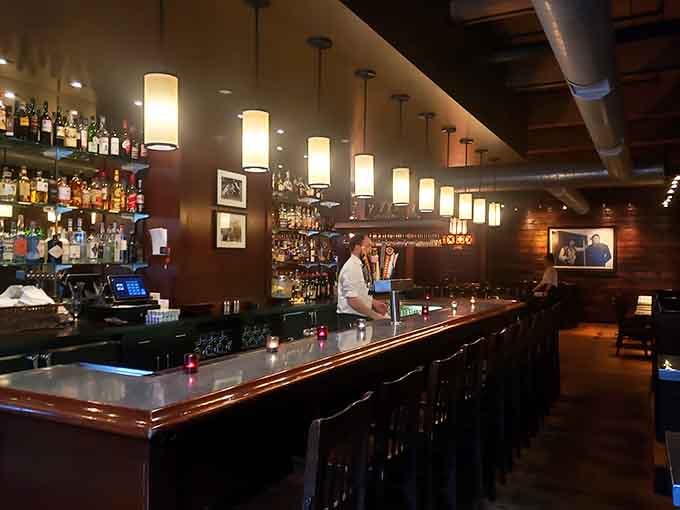 The bar gleams with promise, stocked with everything needed to make your evening memorable and delicious beyond measure.