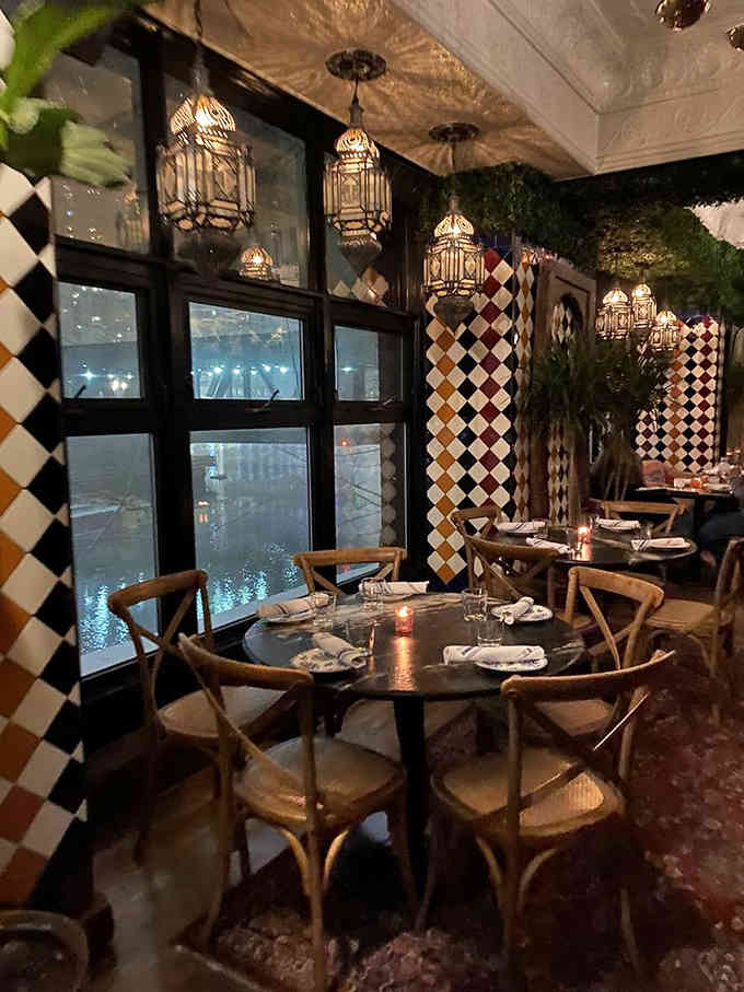 Checkered tile, ornate lanterns, and enough pattern mixing to make your interior designer friend weep with joy or confusion.
