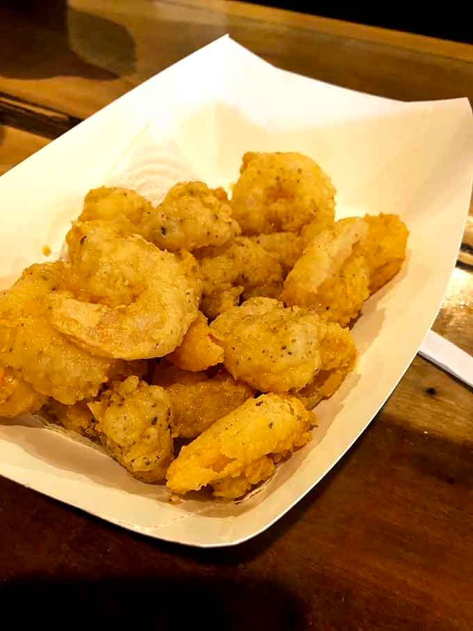 Golden fried shrimp curled up like little treasures, seasoned just right and ready to disappear fast.