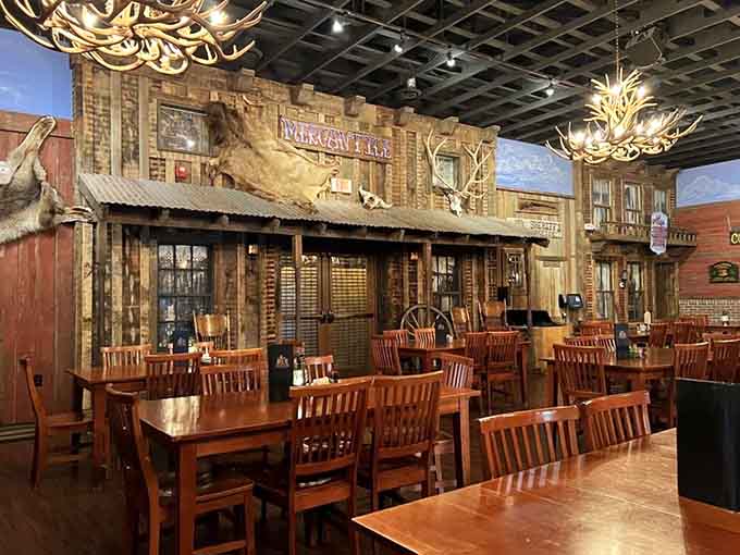 The Old West storefront facade inside creates dining atmosphere that's part history lesson, part theatrical experience, all authentic.
