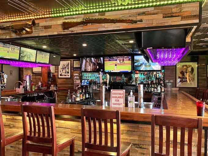 The bar area gleams with promise, offering liquid refreshment to wash down all that glorious smoked meat you're eating.