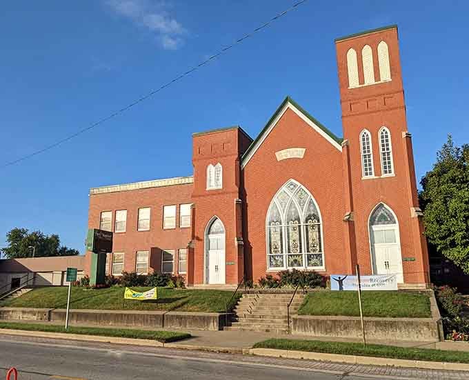 Twin towers reach skyward from this red brick church, a landmark that's guided the faithful home for decades.