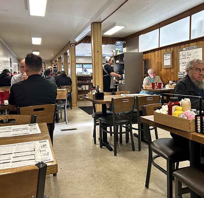 Wood paneling and simple tables create an atmosphere where everyone feels like a welcomed regular customer.
