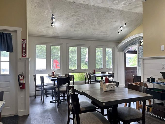 Natural light floods through those windows, creating the kind of welcoming atmosphere where lingering over coffee feels mandatory, not optional.