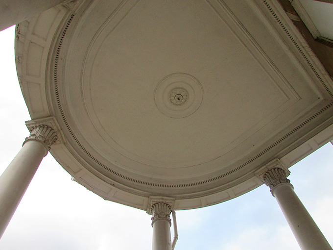Intricate plasterwork adorns this portico ceiling, showcasing craftsmanship that modern builders can only dream about.