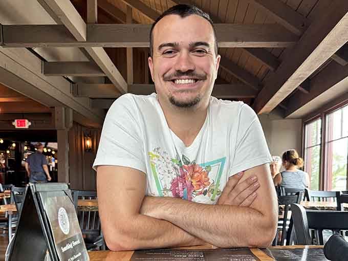 That genuine smile says everything about working somewhere people actually want to be, not just passing through reluctantly.