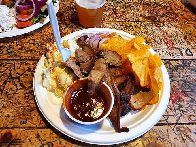 Beef brisket with all the fixings on a table carved with memories is how mountain folk do barbecue properly.