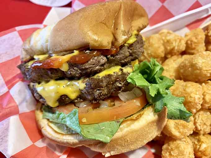 This double-decker burger situation comes with fries that could make a grown person weep with gratitude.